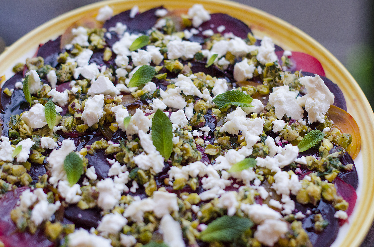 Colorful Beetroot carpaccio with a mint pistachio vinaigrette and goat ...